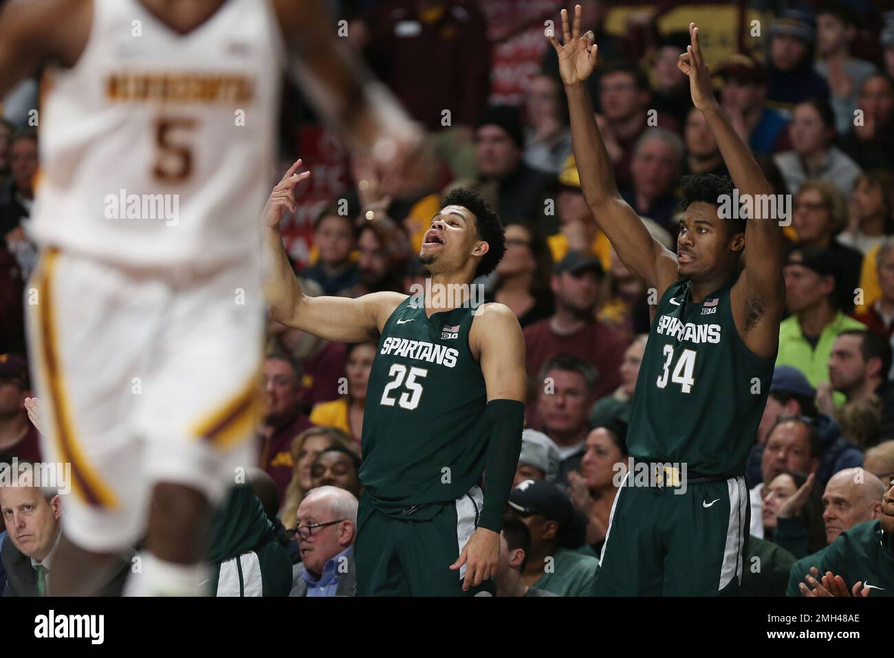 Michigan State's Malik Hall (25) and Julius Marble (34) react to the ...