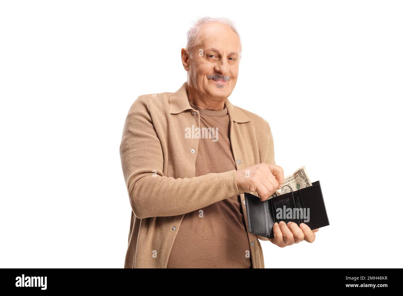 Elderly man putting money in a wallet and smiling at camera isolated on ...