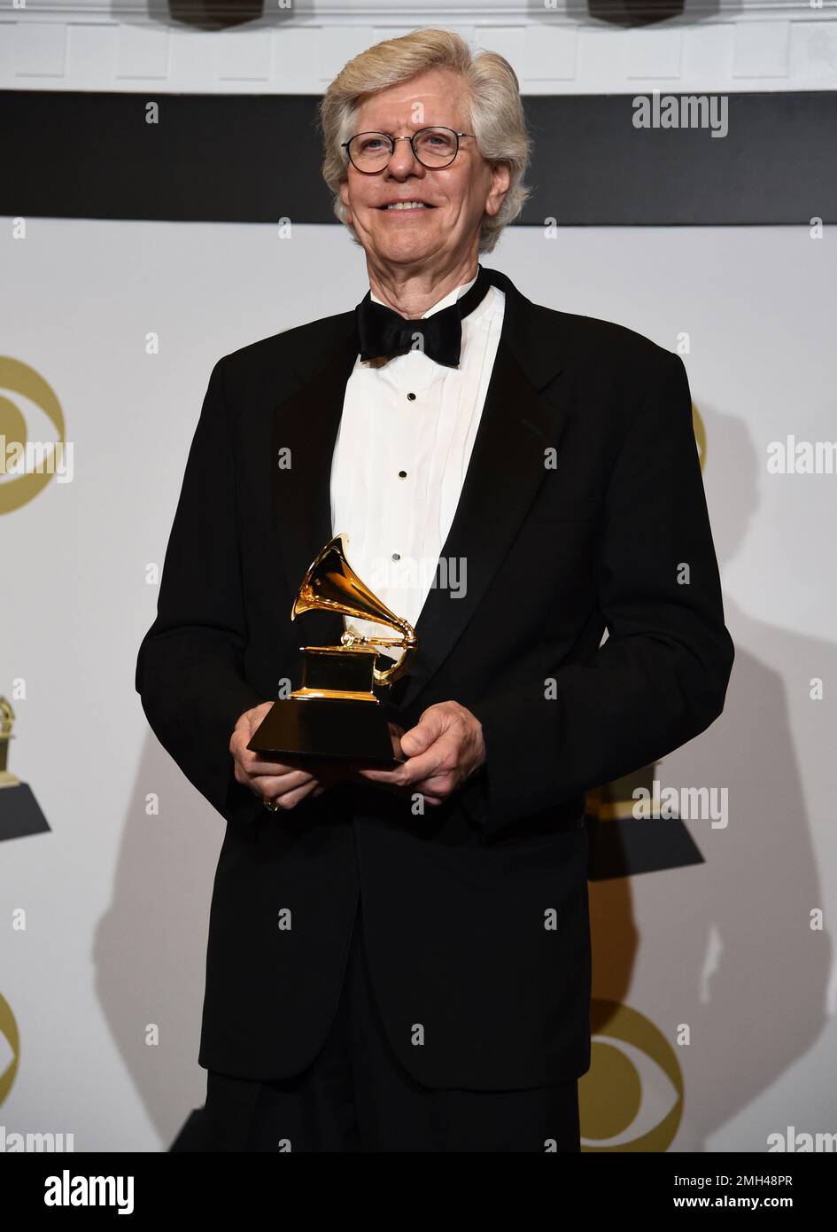 Robert Simpson poses in the press room with the award for best choral ...