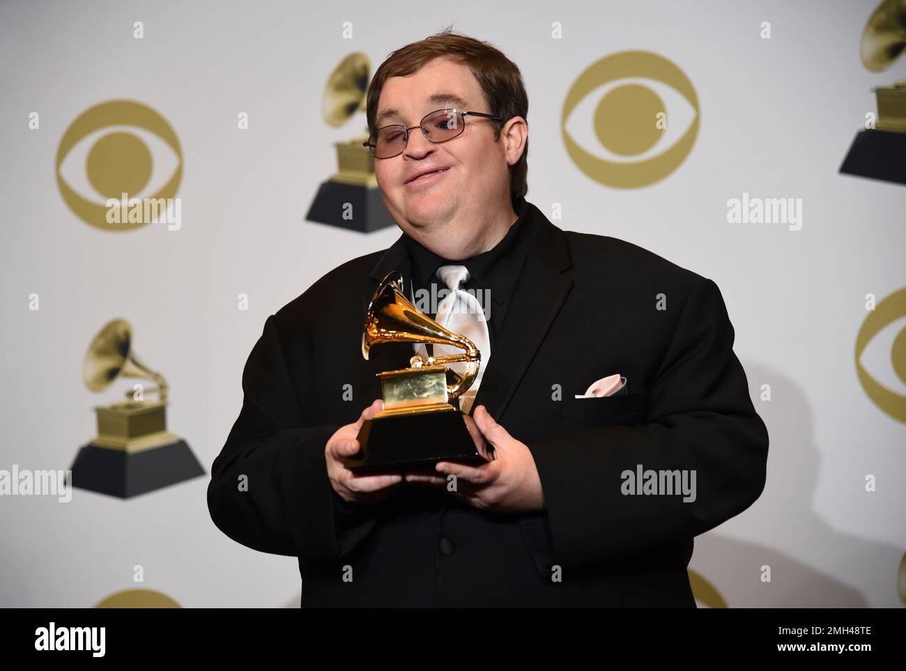 Michael Cleveland poses in the press room with the award for best ...