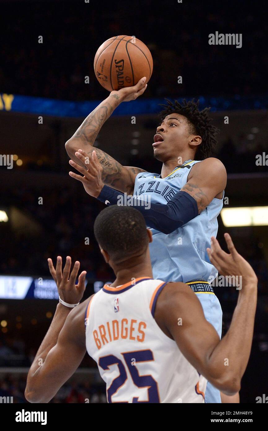 Memphis Grizzlies guard Ja Morant shoots against Phoenix Suns forward ...