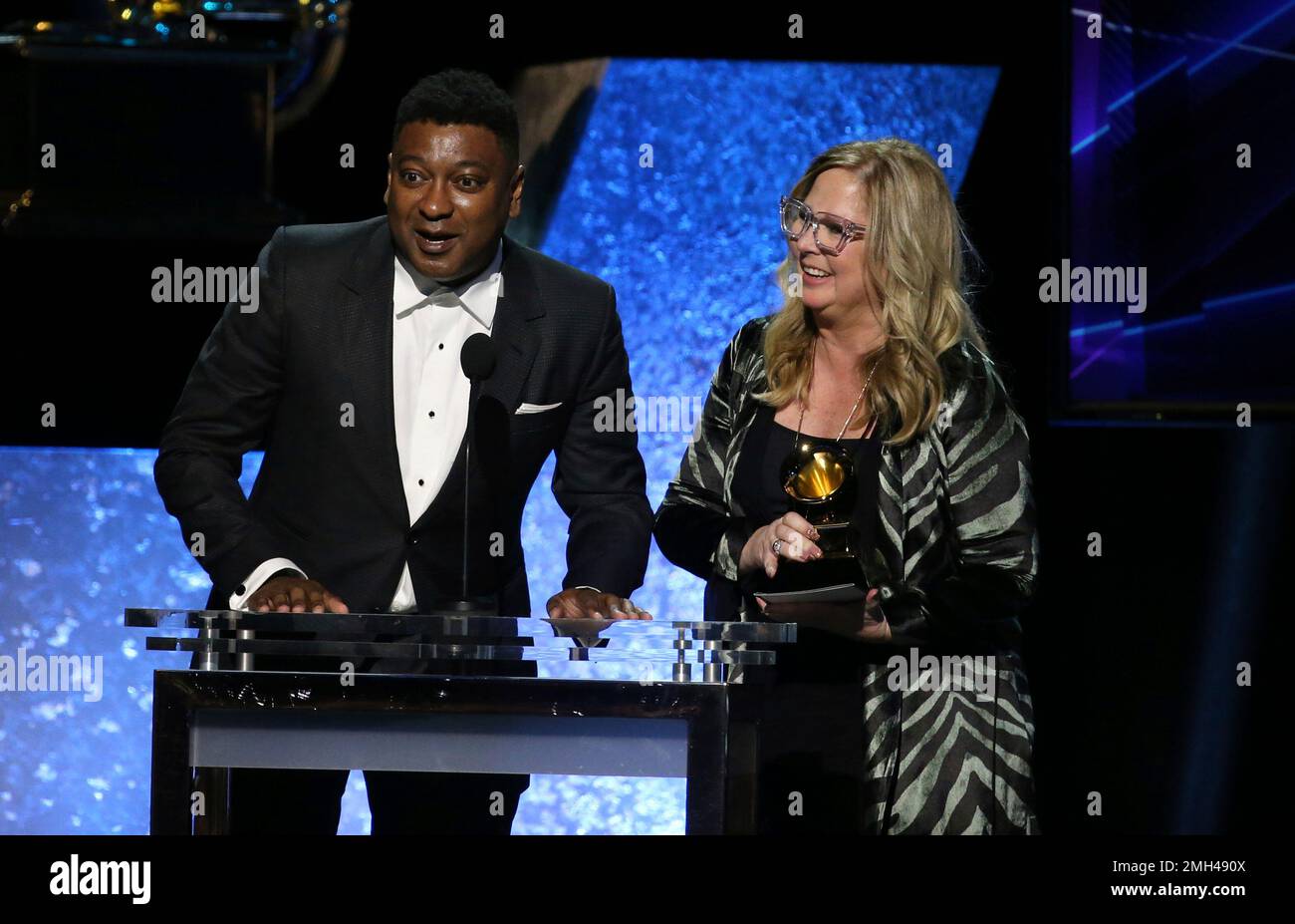 Steve Pamon, left, and Erinn Williams accept the award for best music ...