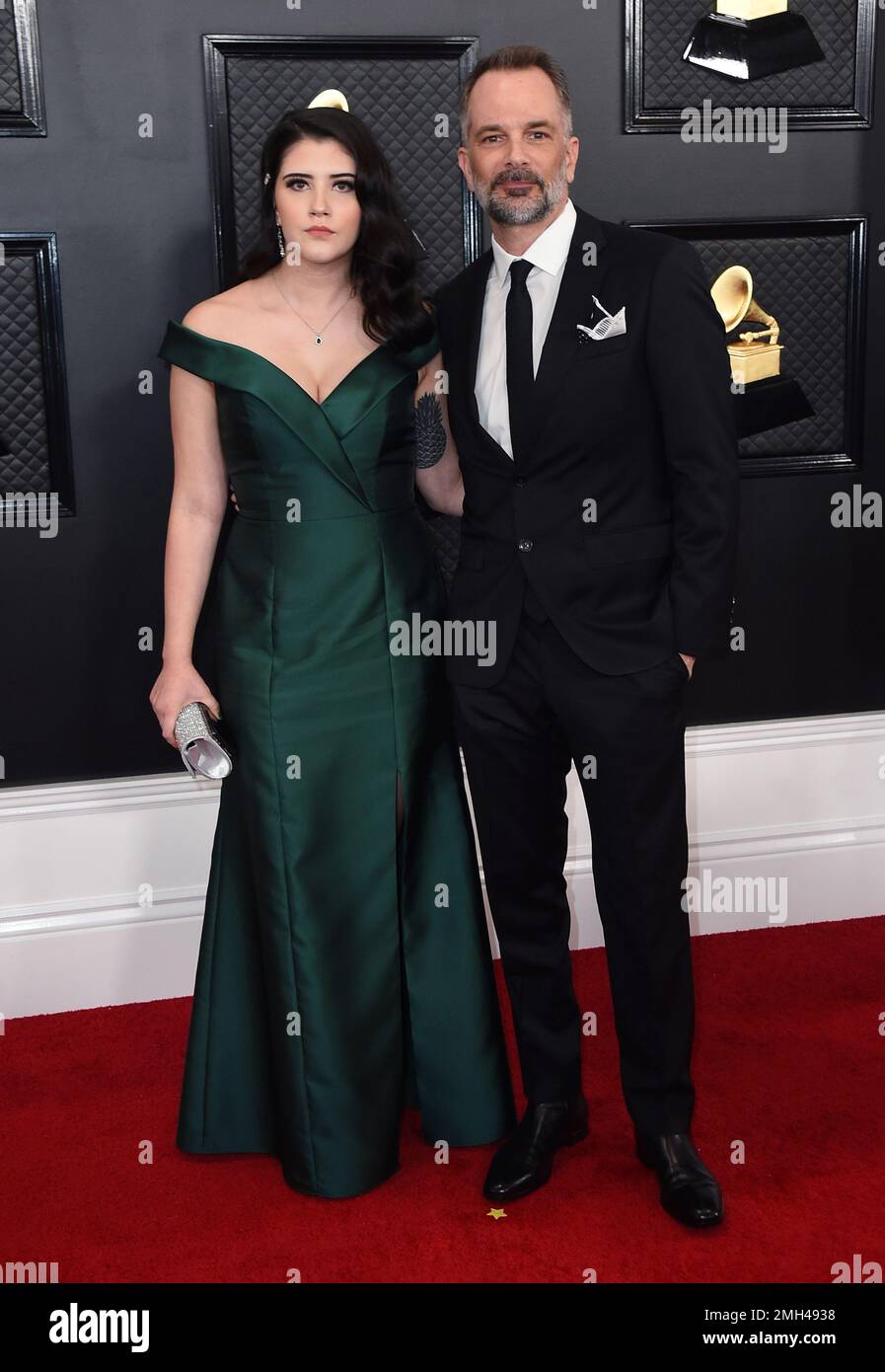 Sloane Bozzi, left, and Mike Bozzi arrive at the 62nd annual Grammy ...