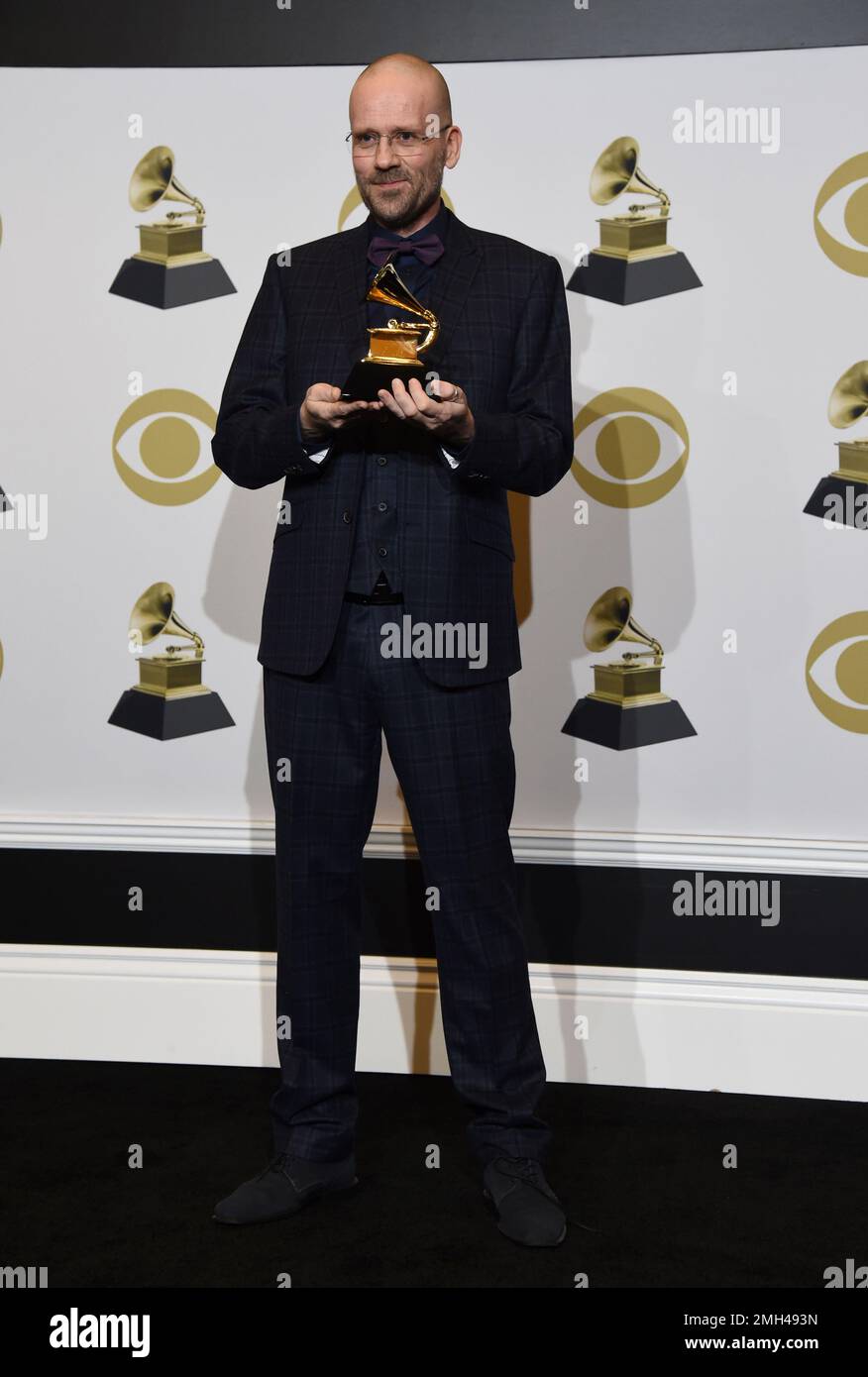 Morten Lindberg poses in the press room with the award for best ...
