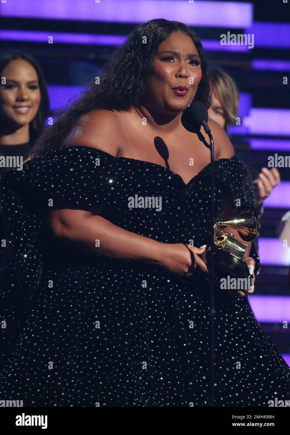 Lizzo accepts the award for best pop solo performance for "Truth Hurts ...
