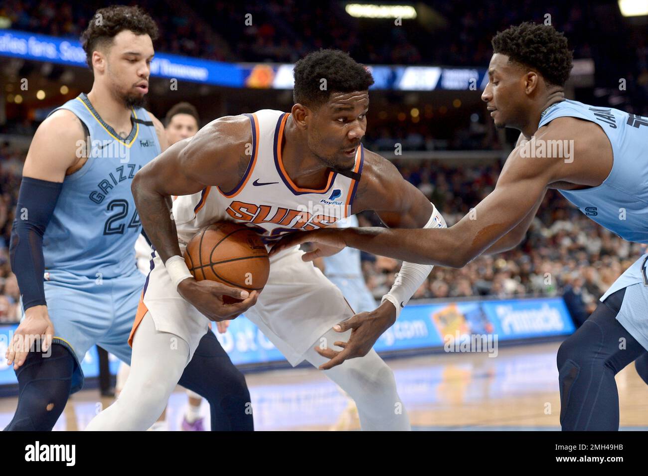 Phoenix Suns center Deandre Ayton, center, handles the ball between ...