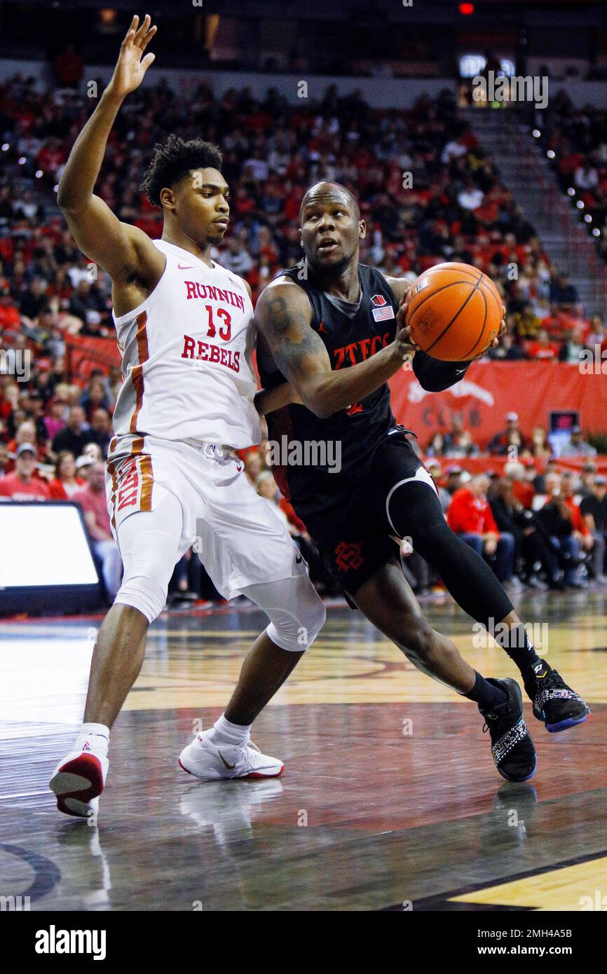 San Diego State's Adam Seiko (2) drives against UNLV's Bryce Hamilton ...