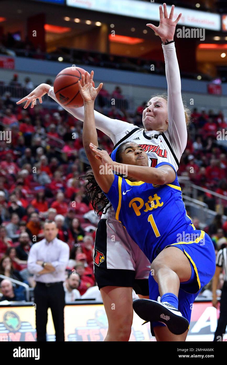 Louisville forward Kylee Shook (21) blocks the shot of Pittsburgh guard ...
