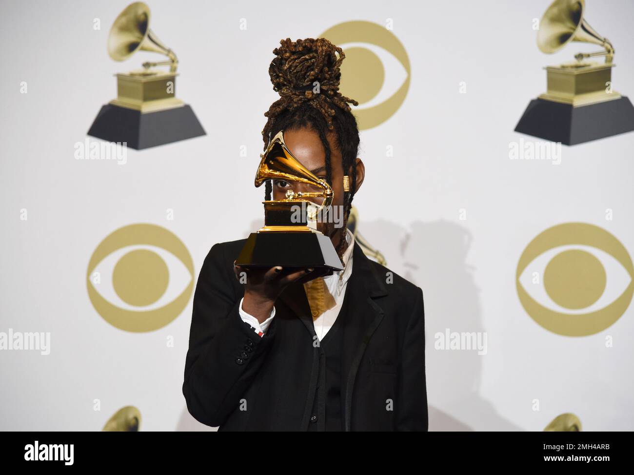 Koffee poses in the press room with the award for best reggae album for ...