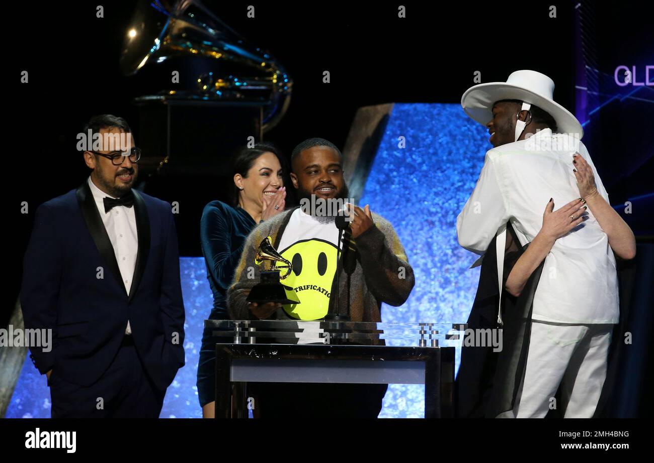 Director Calmatic, center, accepts the award for best music video for ...