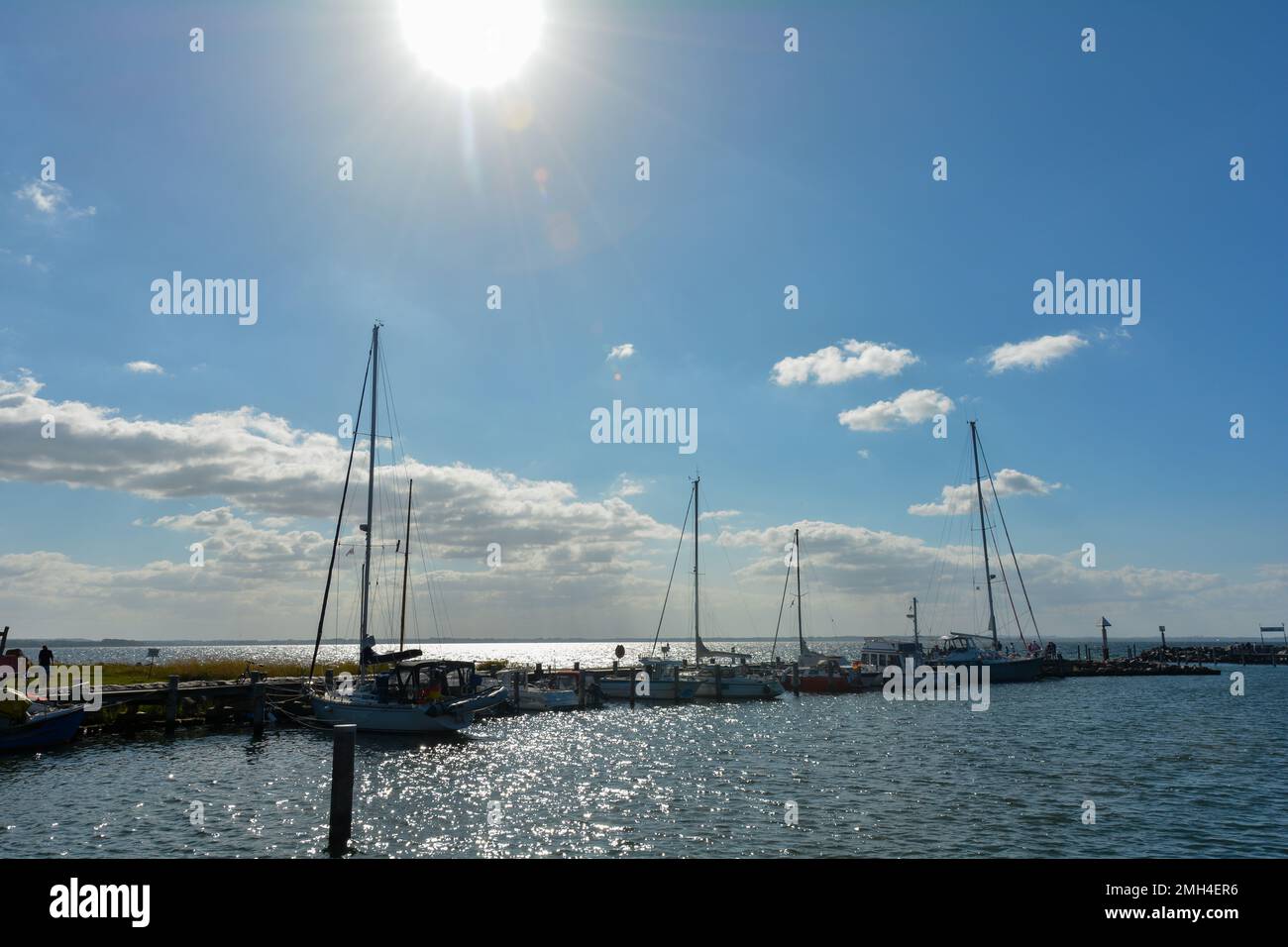 Harbor with boats and sun at Timmendorf Strand, on the island of Poel ...