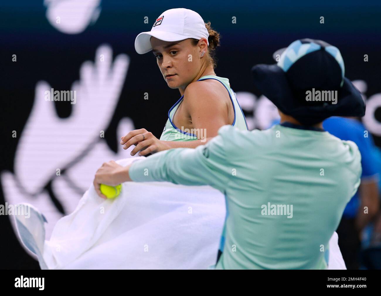 Australia's Ashleigh Barty takes a towel from a ball boy during her ...
