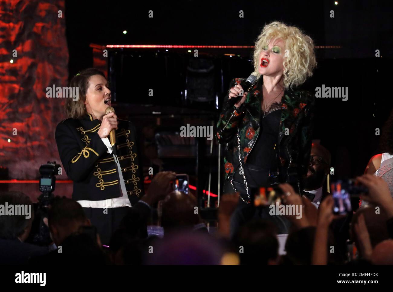 Brandi Carlile, left, and Cyndi Lauper perform on stage at the Pre ...