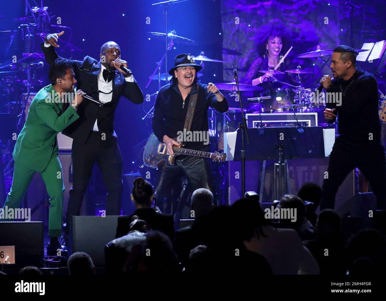 Miguel, from left, Wyclef Jean, Santana, and Andy Vargas perform on ...