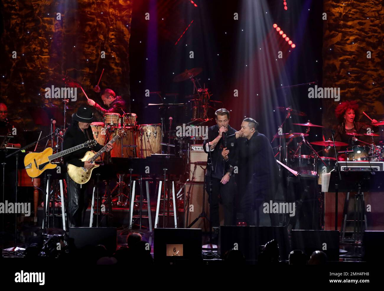 Santana, from left, Rob Thomas, and Andy Vargas perform on stage at the ...