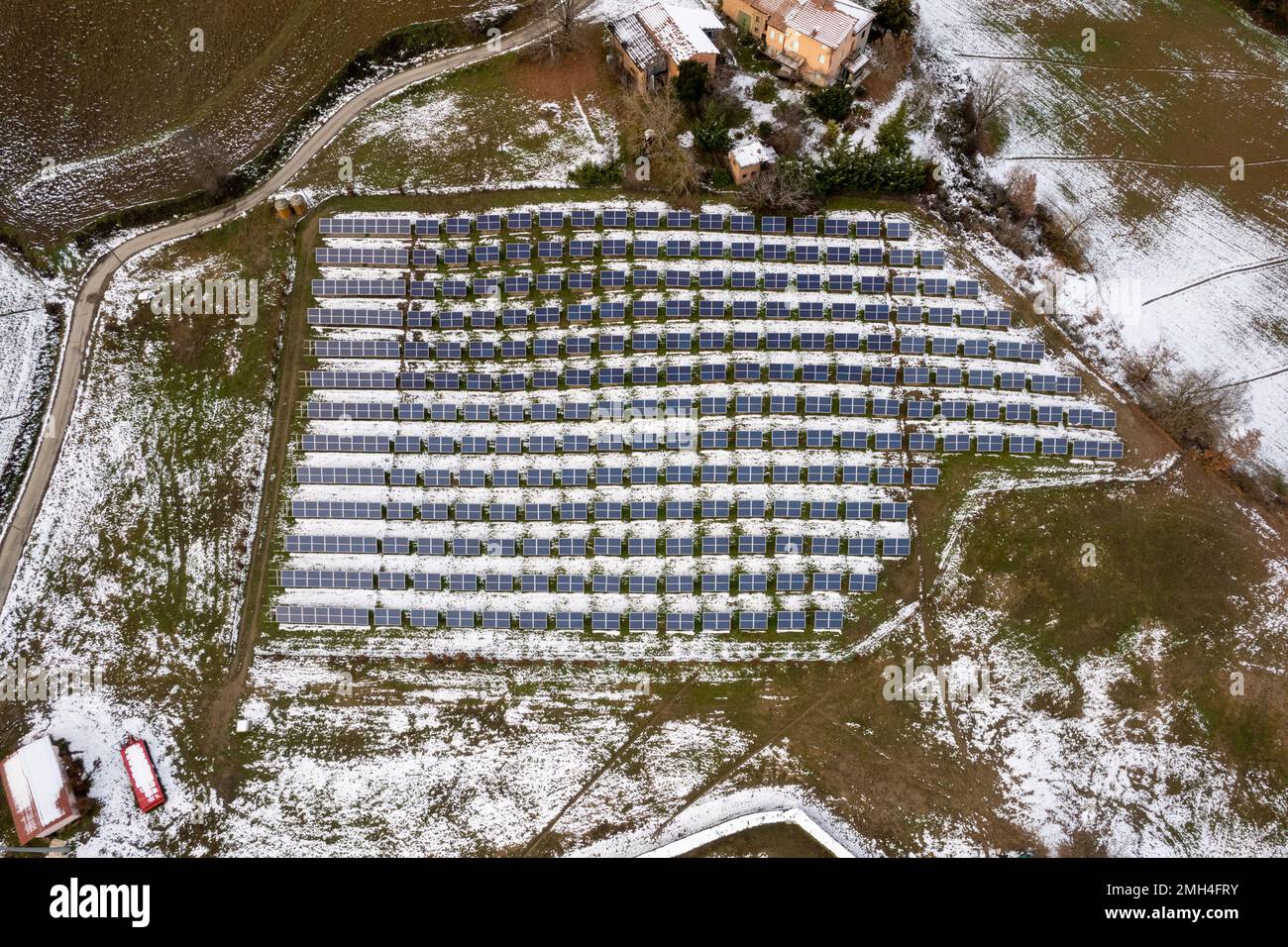 Solar cell photovoltaic panel in snowy country landscape against sunny ...