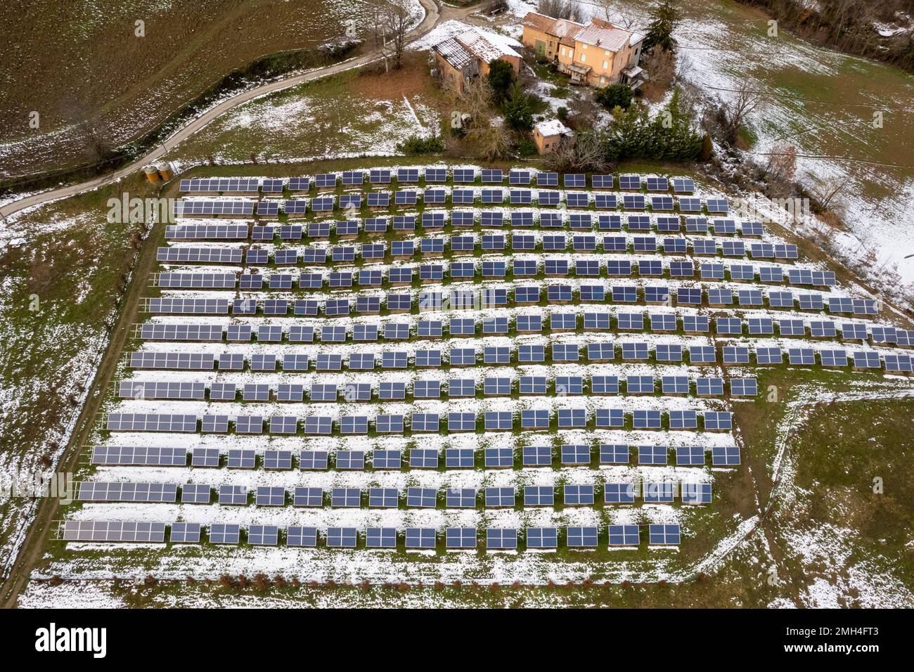 Solar cell photovoltaic panel in snowy country landscape against sunny ...