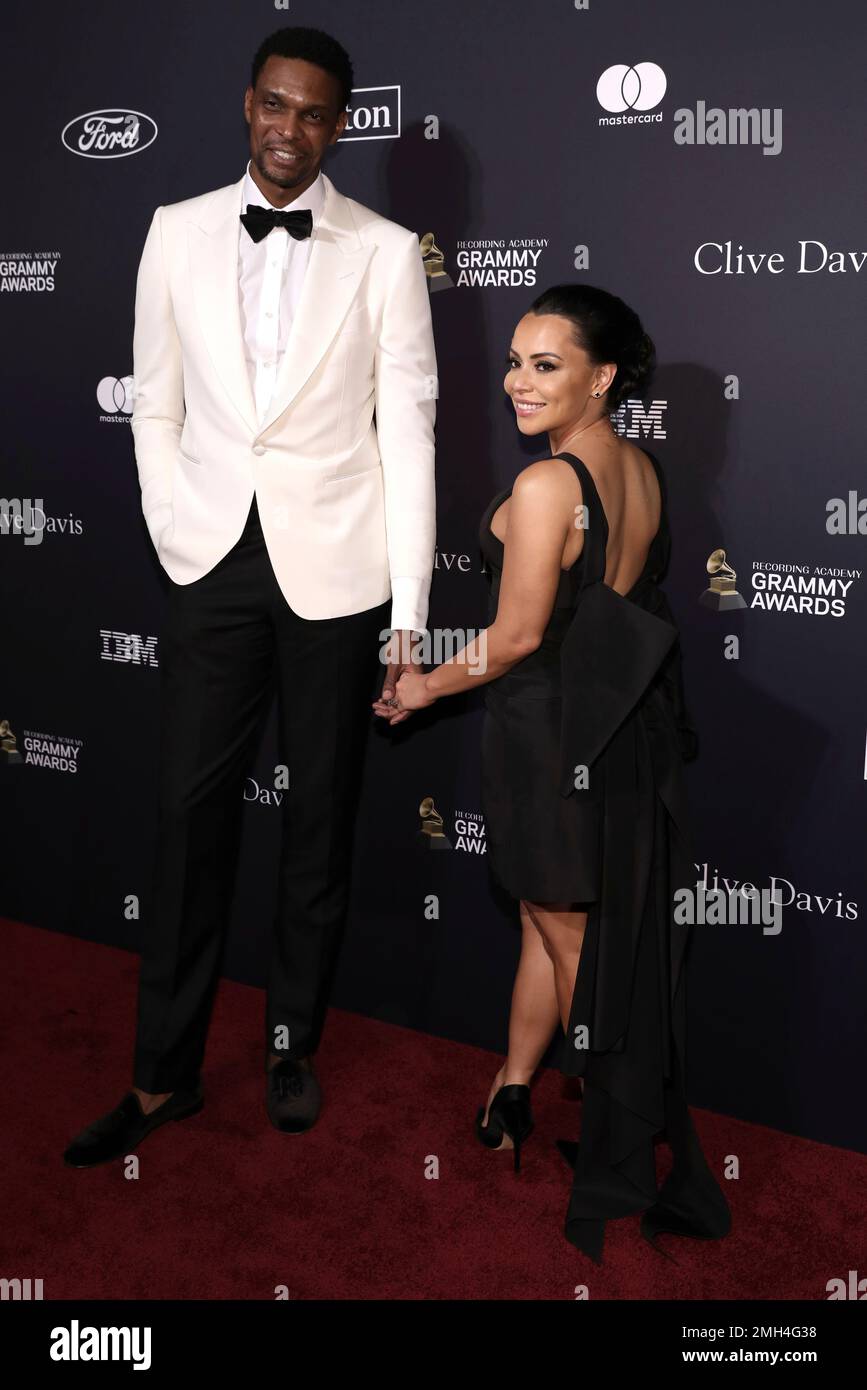 Chris Bosh, left, and Adrienne Bosh arrive at the Pre-Grammy Gala And ...