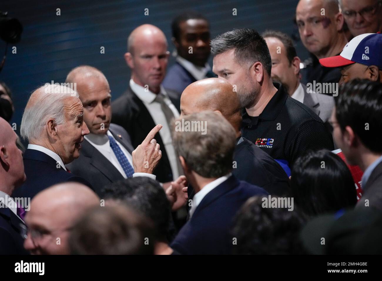 President Joe Biden talks to people after speaking at the Steamfitters ...