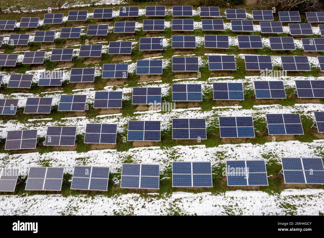 Solar cell photovoltaic panel in snowy country landscape against sunny ...
