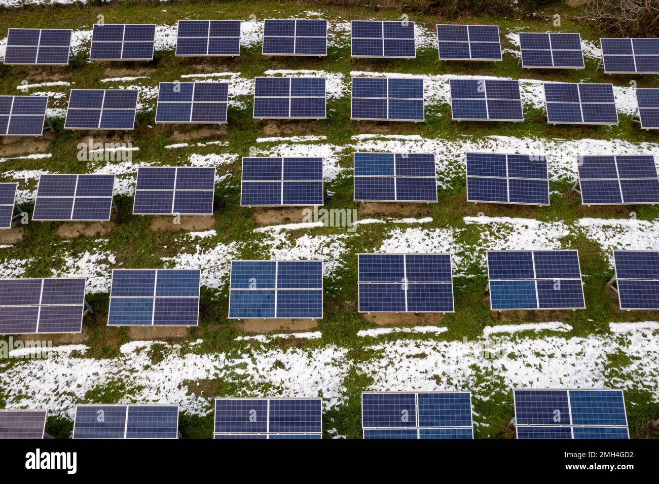 Solar cell photovoltaic panel in snowy country landscape against sunny ...