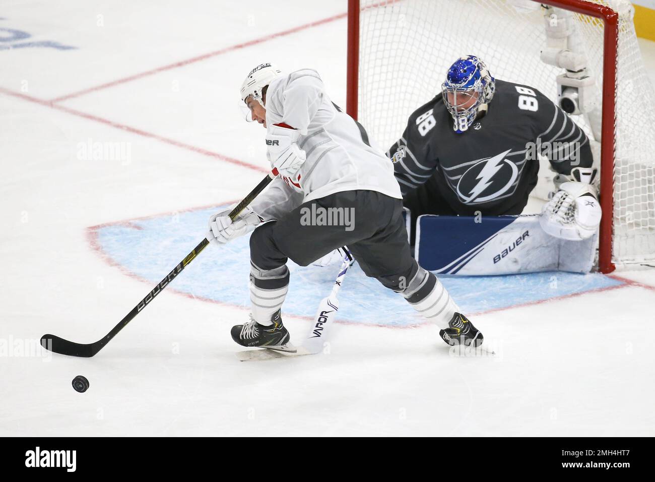 Washington Capitals forward T. J. Oshie (77) reaches for the puck in ...