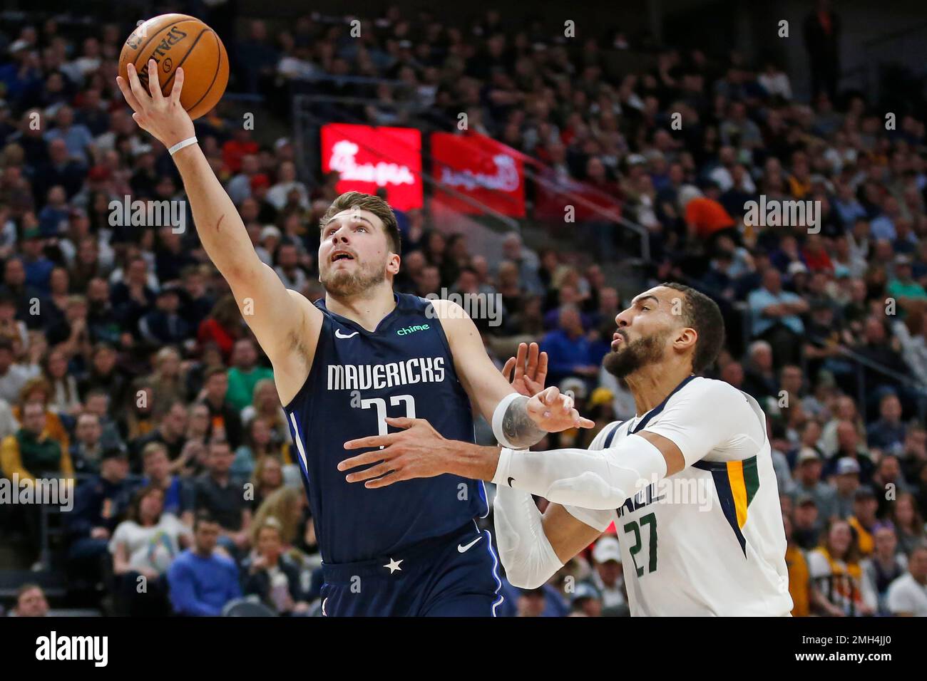 Dallas Mavericks guard Luka Doncic (77) lays the ball up as Utah Jazz ...