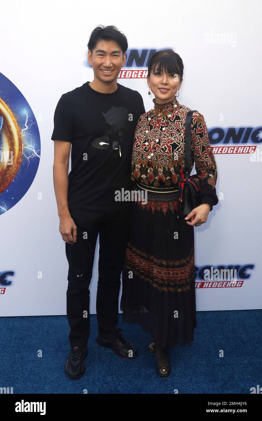CEO of SEGA Haruki Satomi, left, and guest arrive at the LA Premiere of ...