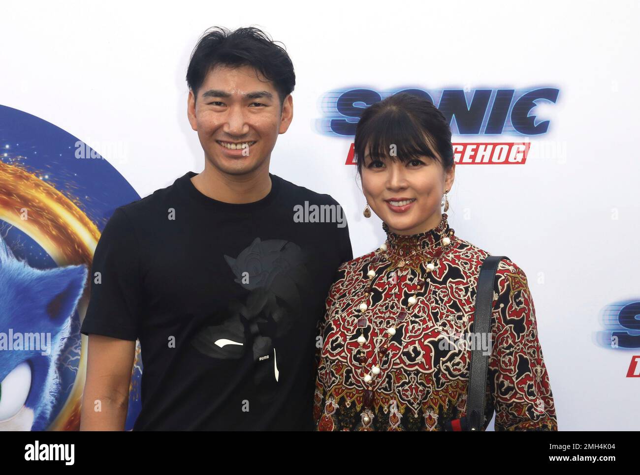 CEO of SEGA Haruki Satomi, left, and guest arrive at the LA Premiere of ...