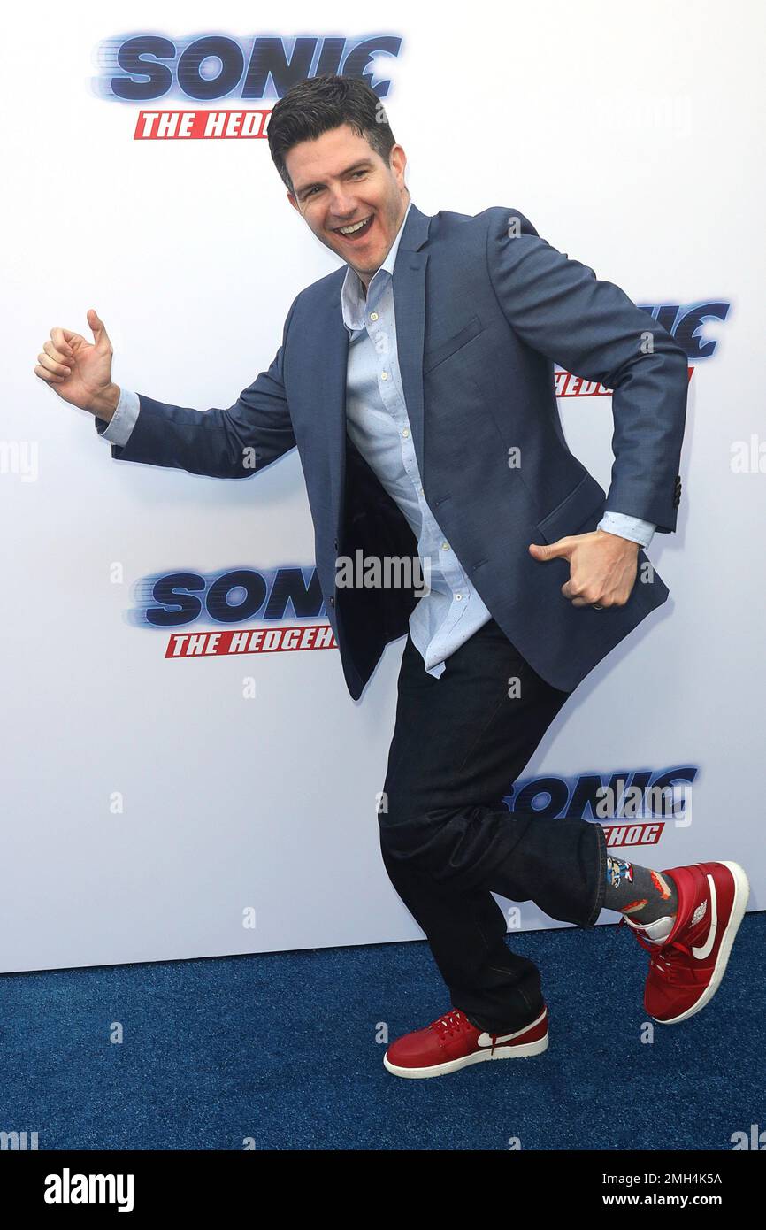 Director Jeff Fowler pretends he is running like Sonic as he arrives at ...
