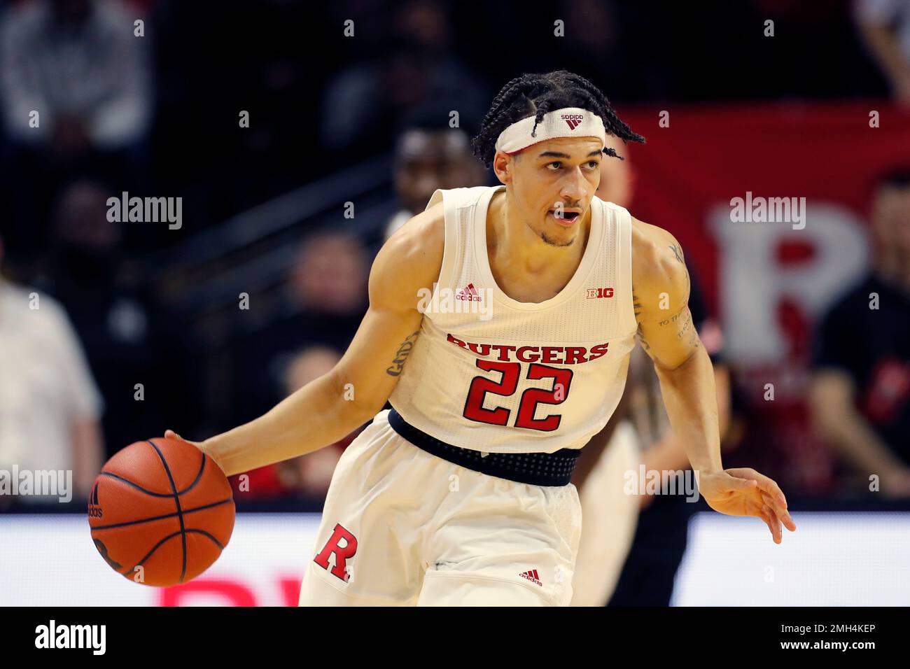 Rutgers guard Caleb McConnell (22) brings the ball up court during the ...