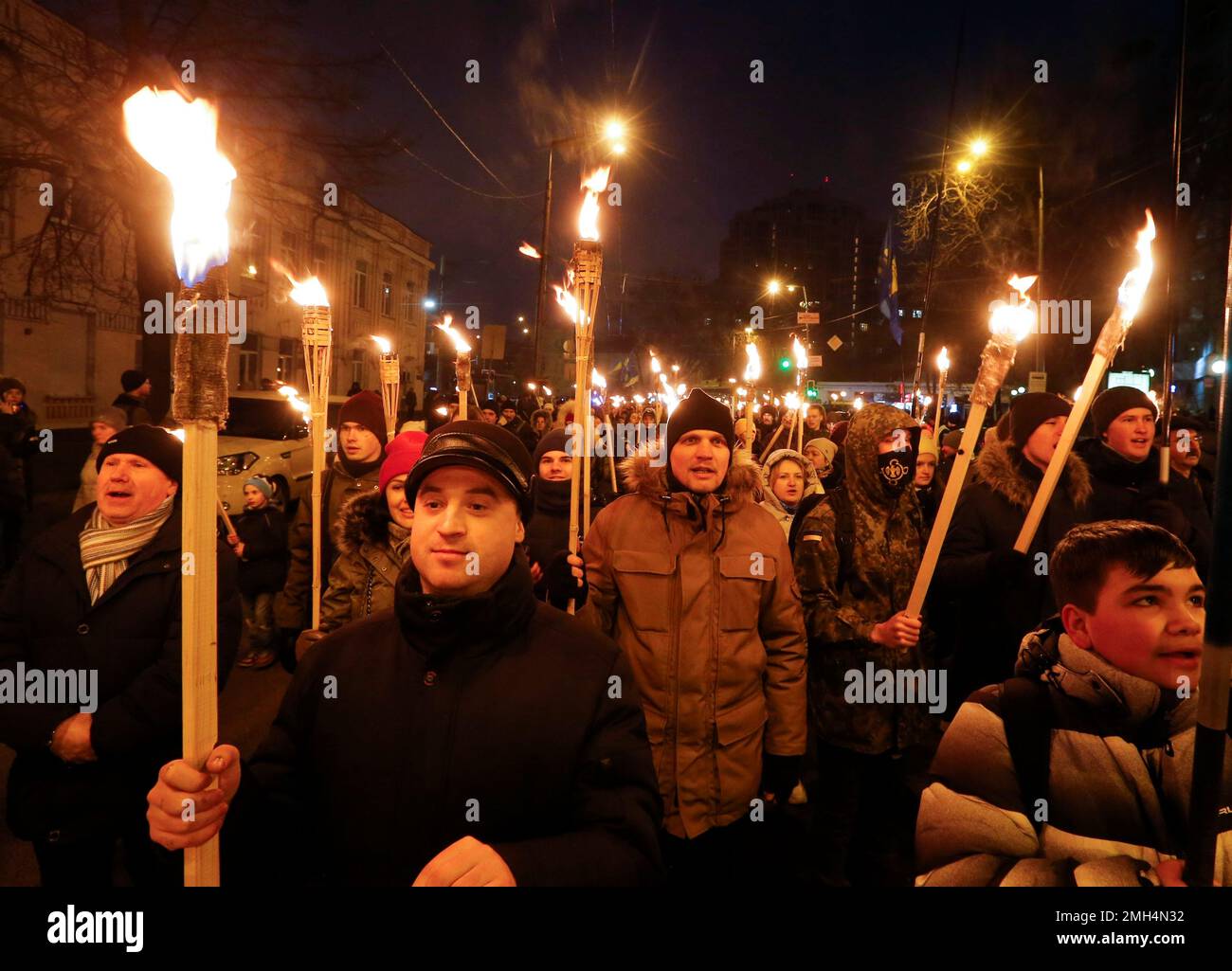 Some hundreds of people march with torches to commemorate the 102nd ...
