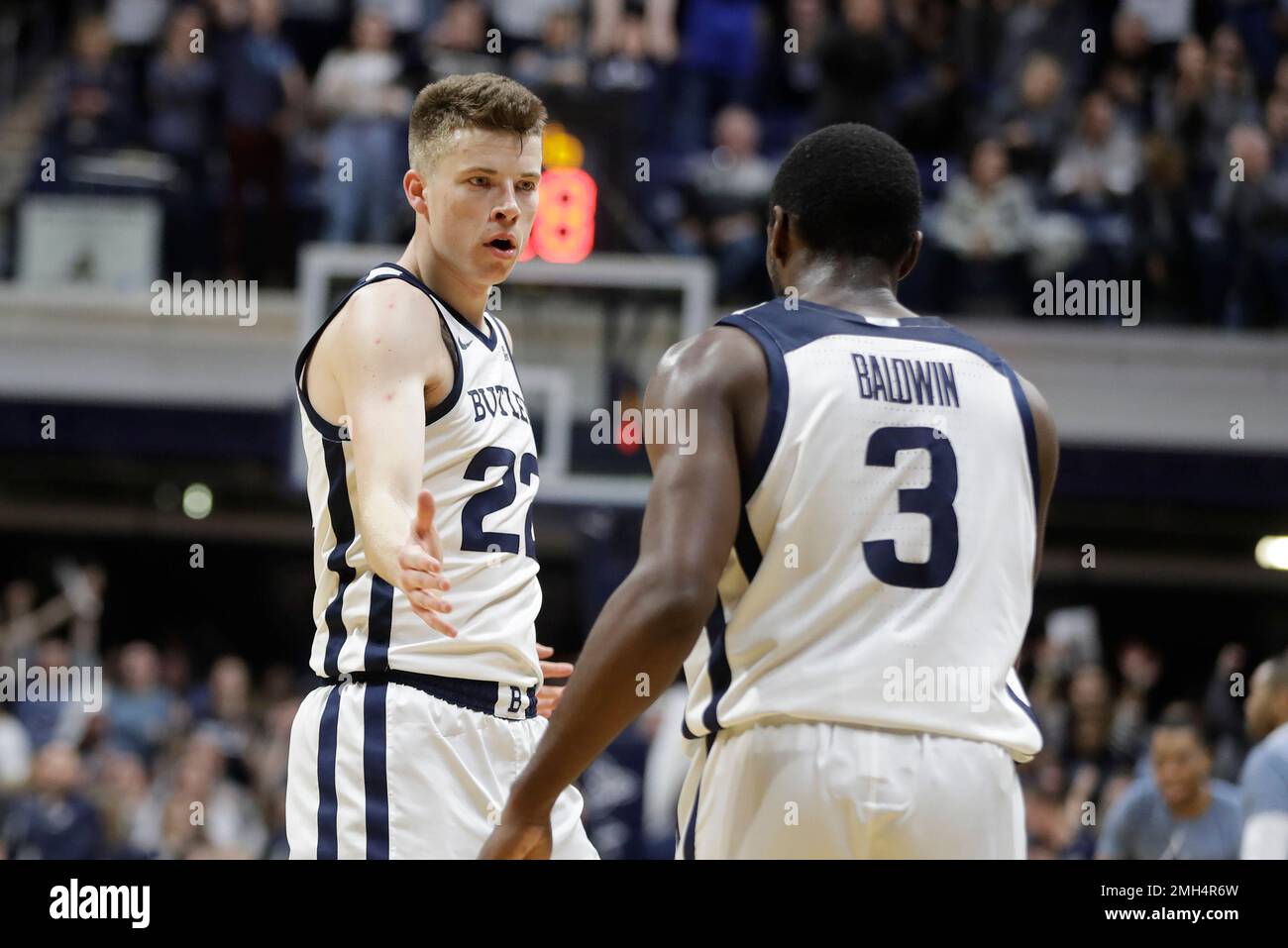 Butler's Sean McDermott (22) talks with Kamar Baldwin (3) during ...