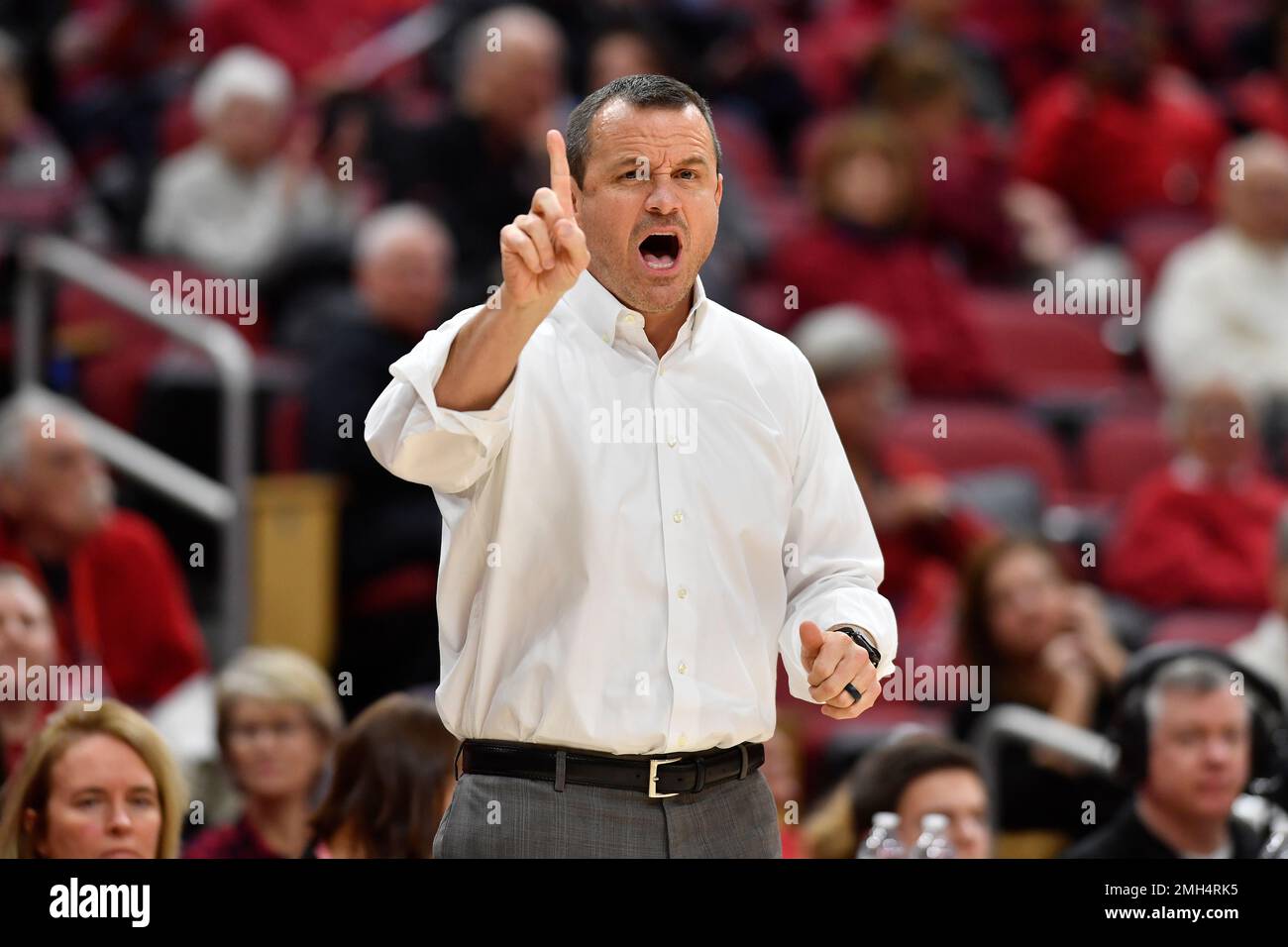 Louisville head coach Jeff Walz instructs his team during the first ...
