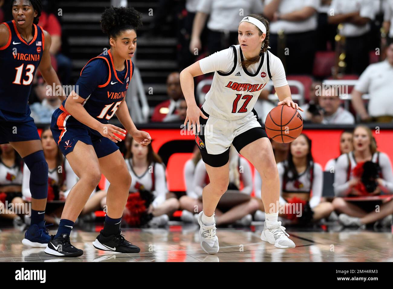 Louisville guard Lindsey Duvall (12) keeps the ball away from Virginia ...