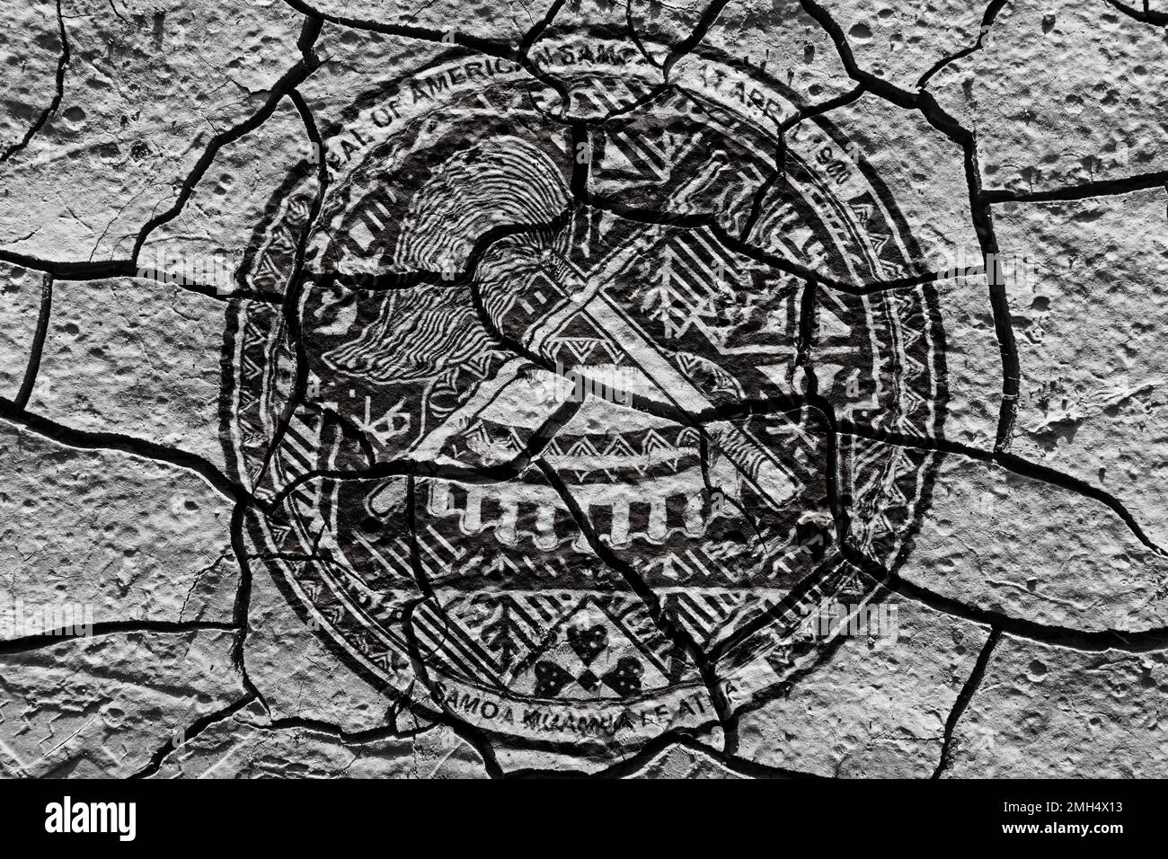 American Samoa state Seal flag of United States on a mud texture of dry ...