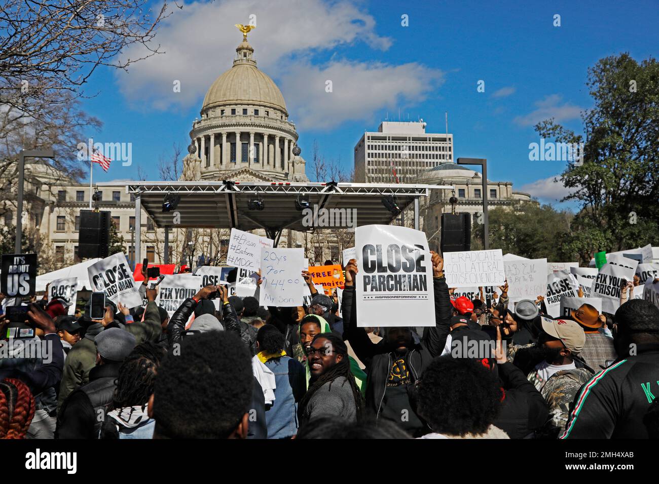 Several hundred people gather in front of the Mississippi Capitol in ...