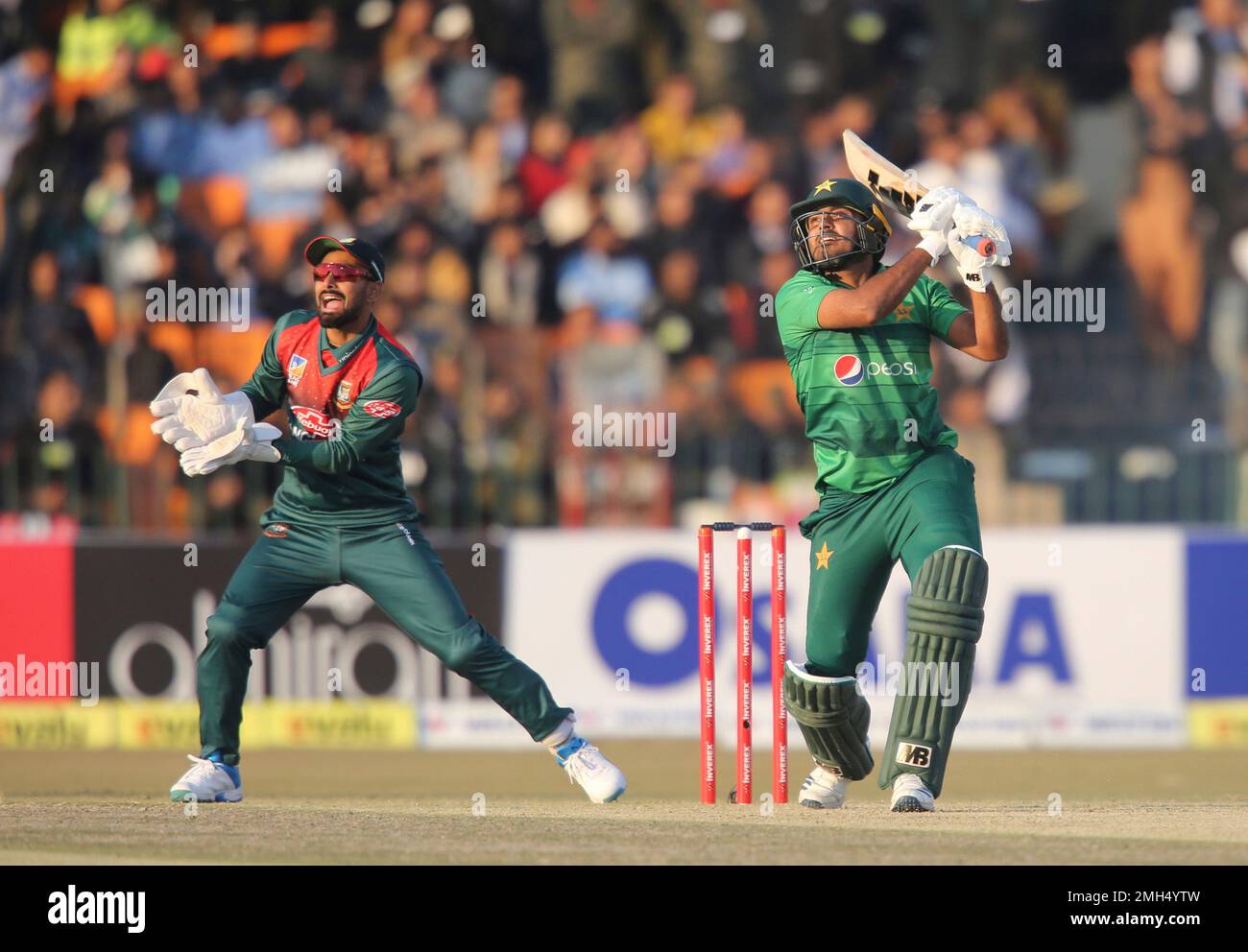 Pakistan's Ahsan Ali plays boundary as Bangladeshi wicketkeeper Liton ...