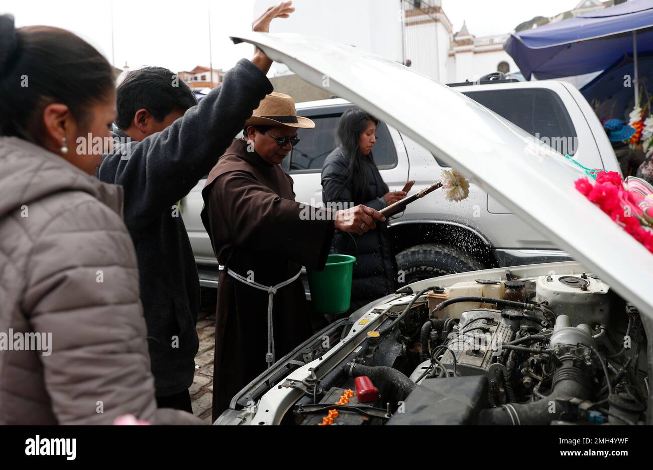 In this Jan. 11, 2020 photo, A Catholic priest blesses a car during the ...
