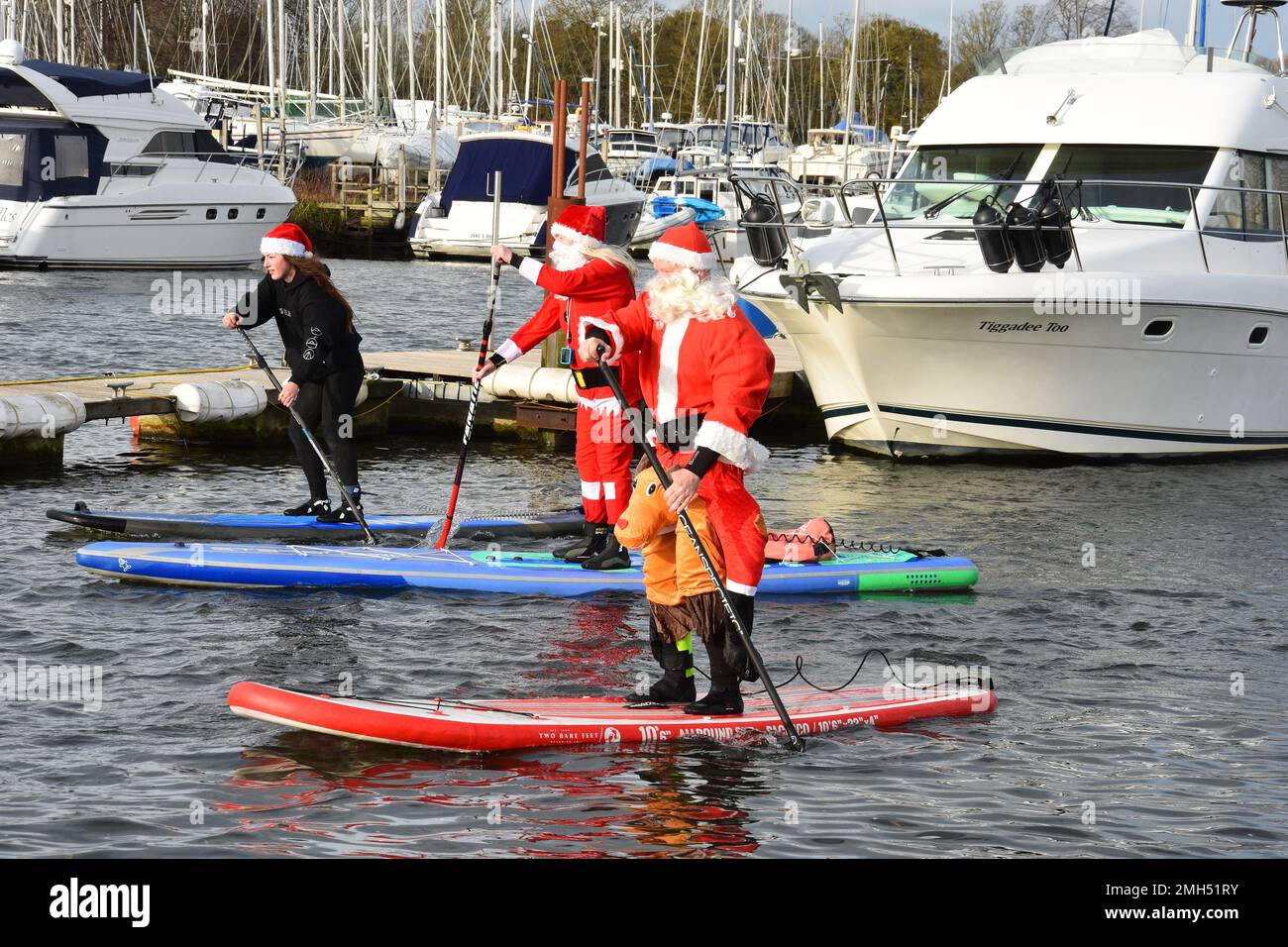 Santa on a paddle board hi-res stock photography and images - Alamy