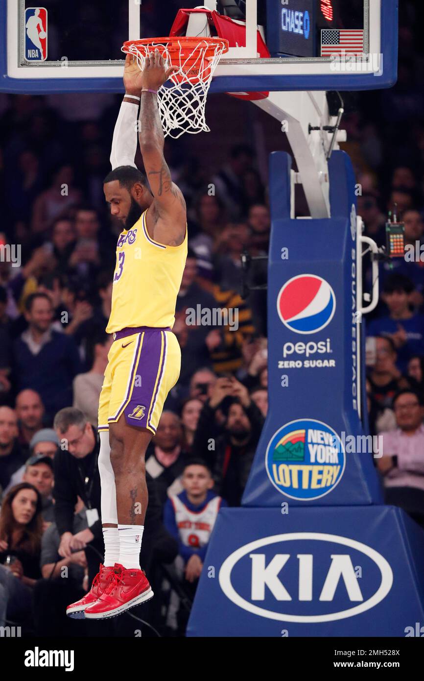 Los Angeles Lakers forward LeBron James (23) hangs from the rim as part ...