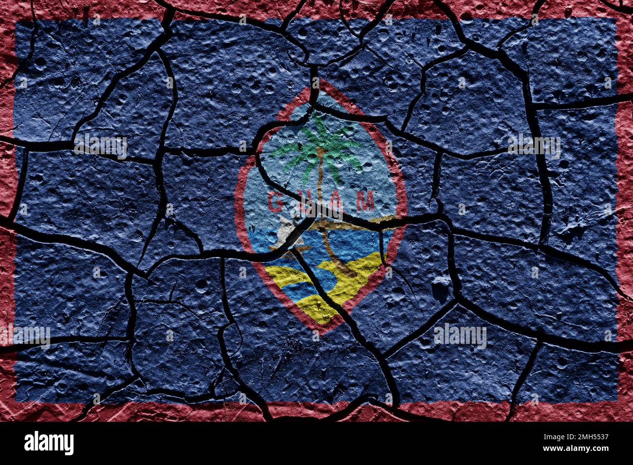 Guam state flag of United States on a mud texture of dry crack on the ...