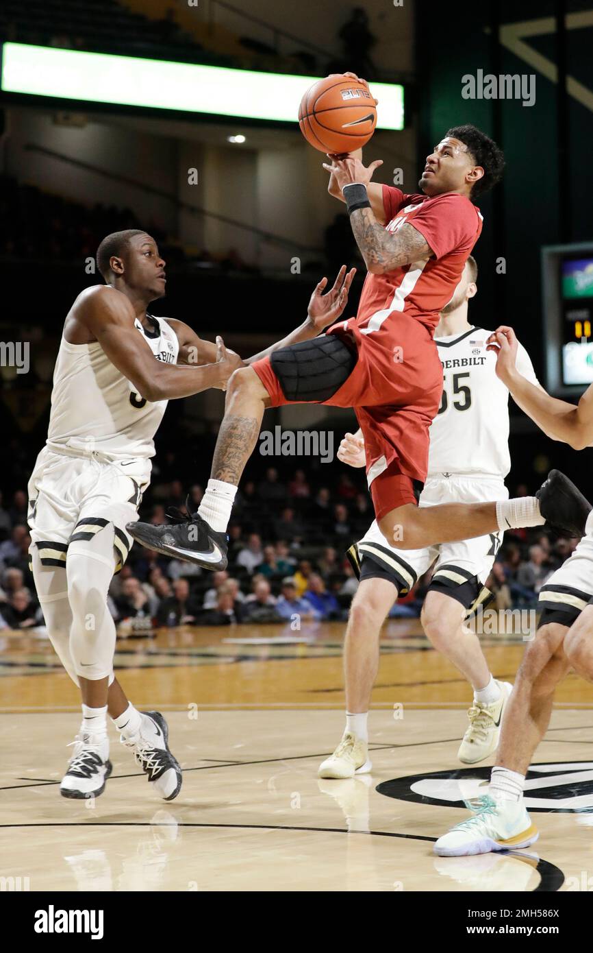 Alabama guard James Bolden, right, shoots against Vanderbilt guard ...