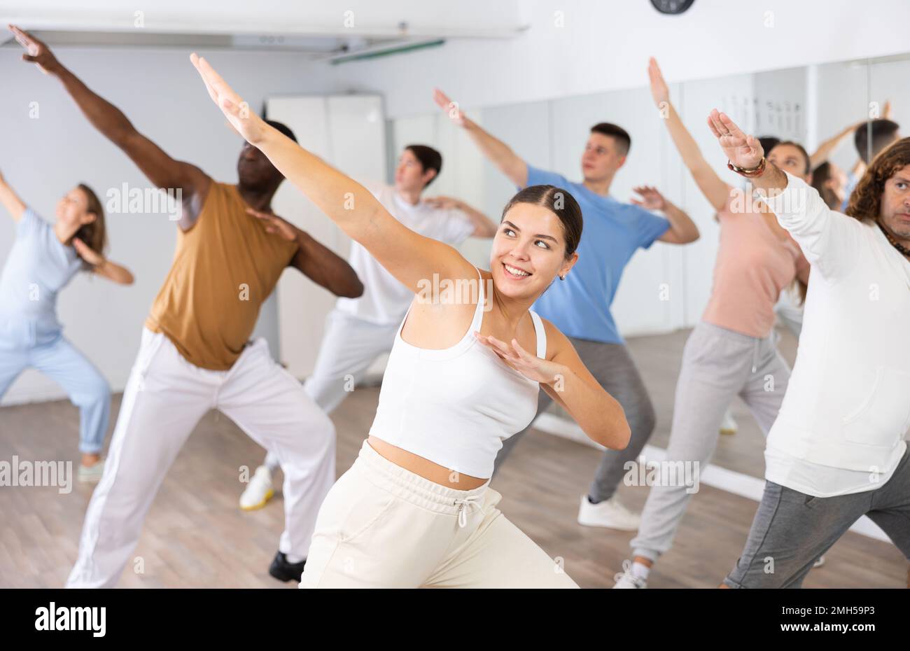 Happy active energetic multiracial dancers of different ages dancing ...