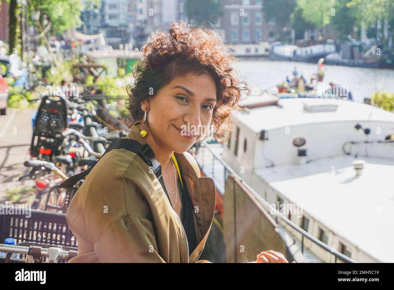 Woman in front amsterdam hi-res stock photography and images - Alamy