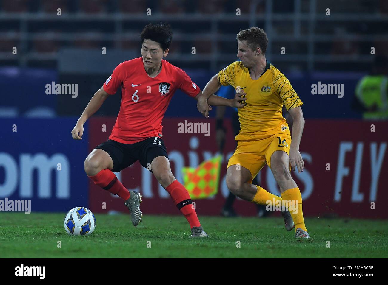 Kim Dong-hyeon of South Korea, left, fights for the ball with Trent ...