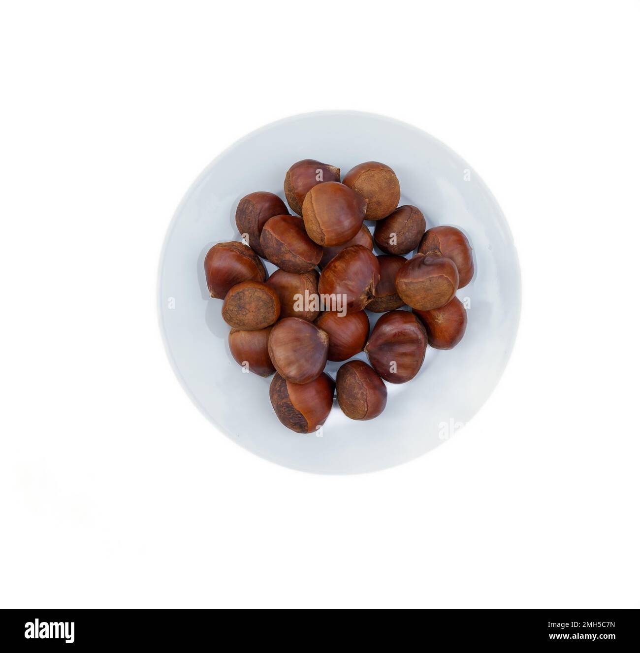 On white plate, Chinese chestnuts sold in the US. There are photo and ...