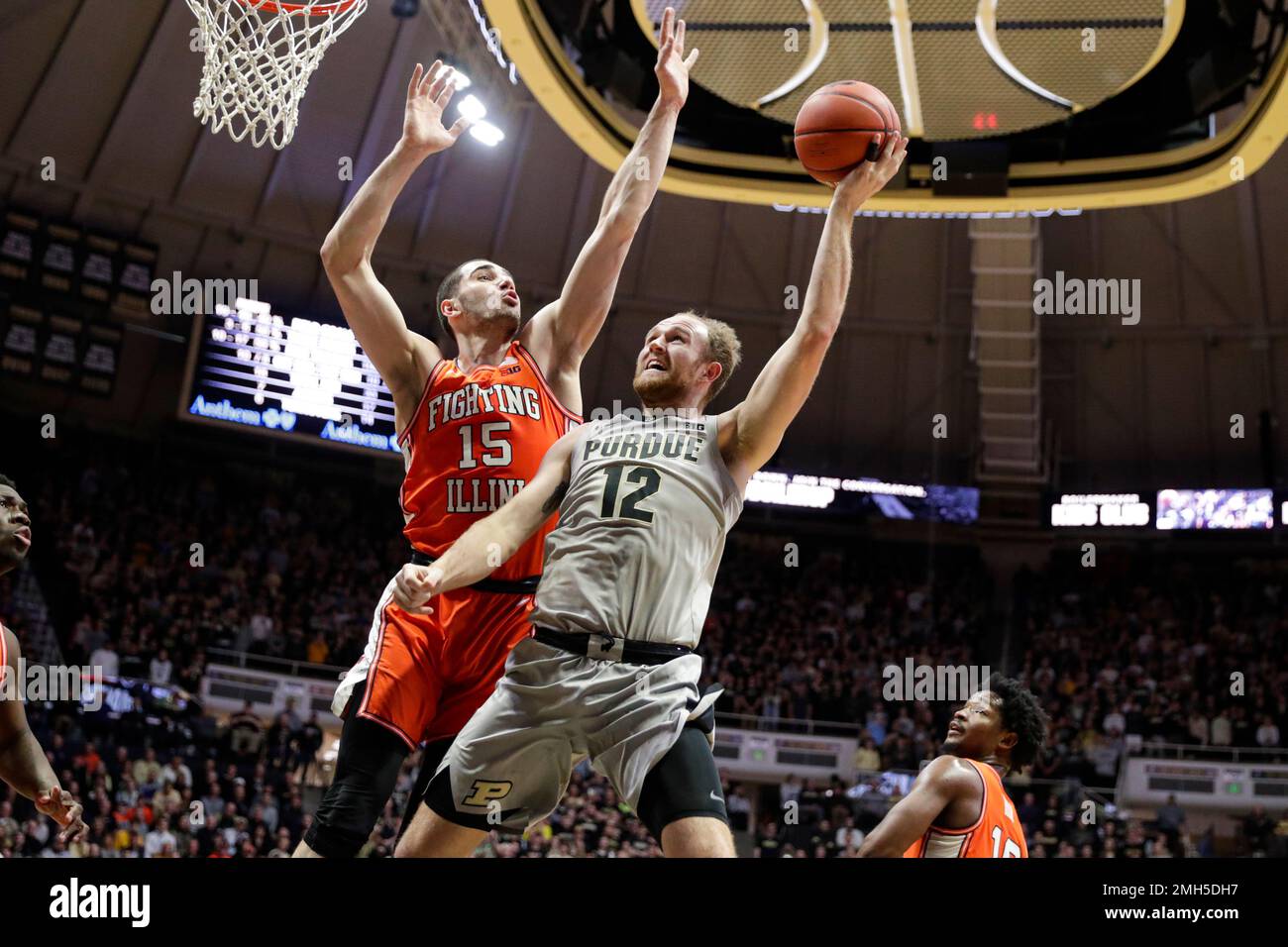 Purdue guard Tommy Luce (15) goes up to block the shot of Purdue ...