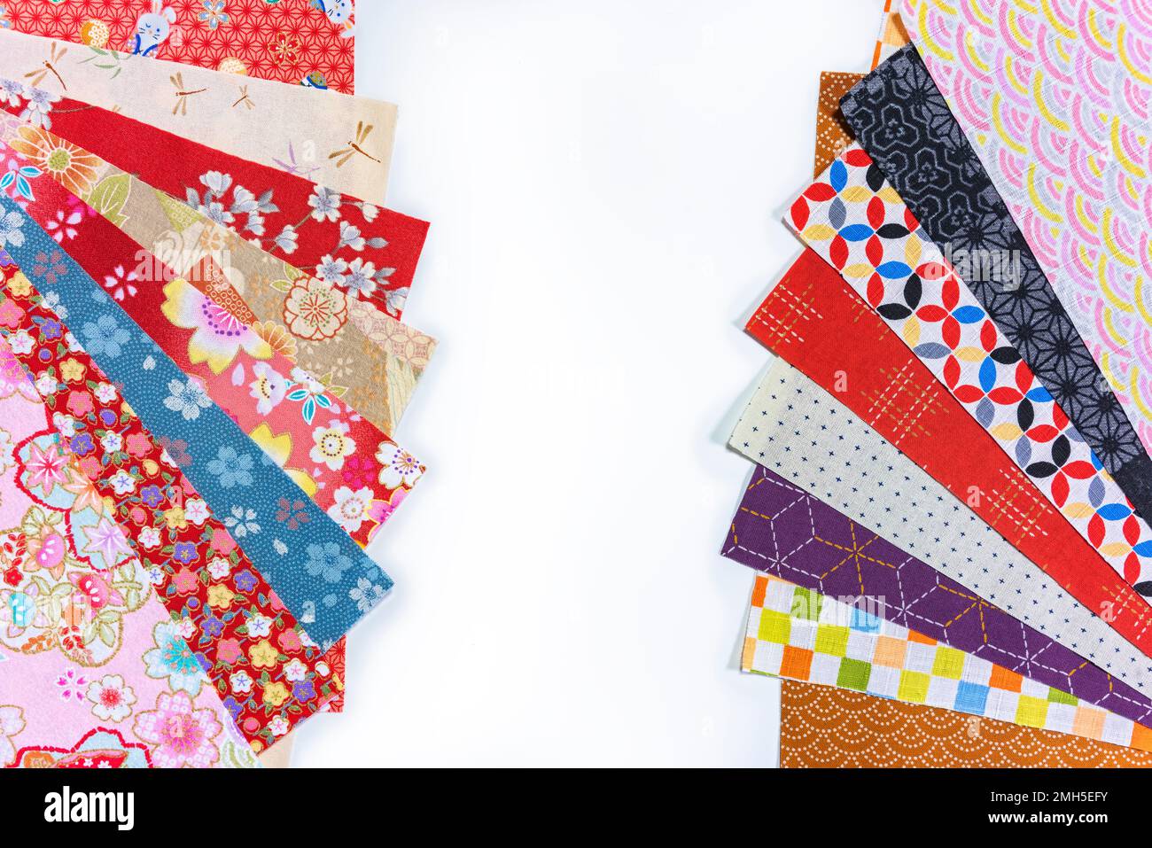 Symmetrical Stack Of Spread Out Furoshiki Fabrics Adorned With A Large