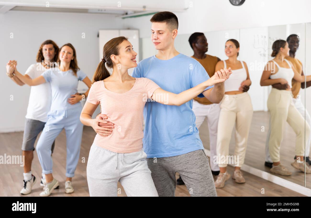 Young girl and teen boy dancing pair dance Stock Photo - Alamy